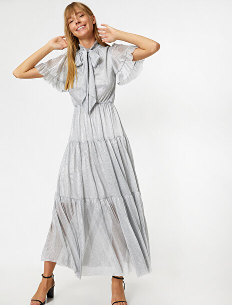 Koton Kadın Metalik Elbise Abiye Desenli Tül Bel Büzgülü Volanlı Kısa Kollu Uzun Koton Kadın Metalik Elbise Abiye Desenli Tül Bel Büzgülü Volanlı Kısa Kollu Uzun