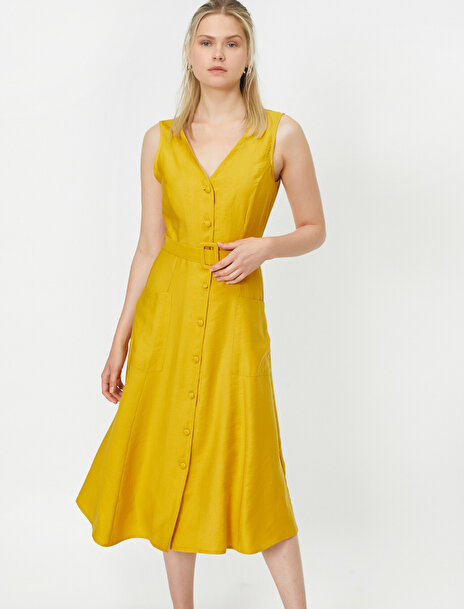 Koton Kadın V Yaka Kolsuz Düğme Detaylı Kemerli Cep Detaylı Midi Elbse Koton Kadın V Yaka Kolsuz Düğme Detaylı Kemerli Cep Detaylı Midi Elbse