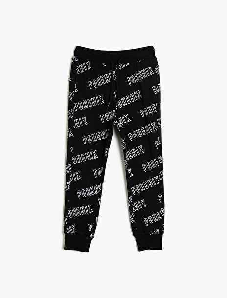 Koton Erkek Çocuk Desenli Yumuşak Tüylü Sweatshirt Kumaşından Ribanalı Jogger Eşofman Altı Koton Erkek Çocuk Desenli Yumuşak Tüylü Sweatshirt Kumaşından Ribanalı Jogger Eşofman Altı
