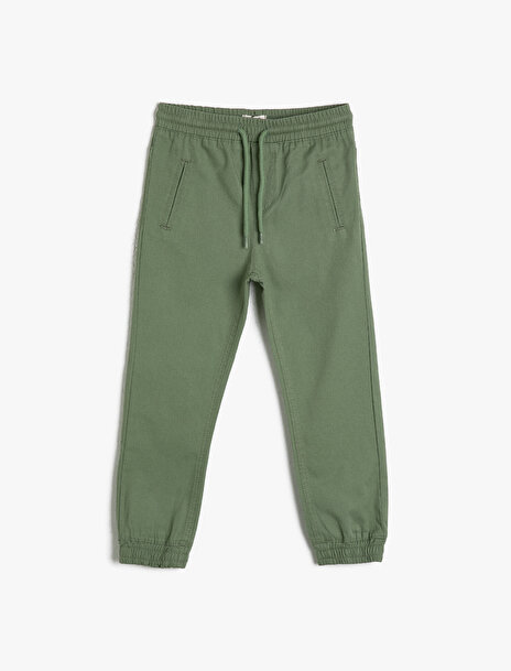 Koton Erkek Çocuk Beli ve Paçası Lastikli Pamuklu Gabardin Kumaştan Jogger Pantalon Koton Erkek Çocuk Beli ve Paçası Lastikli Pamuklu Gabardin Kumaştan Jogger Pantalon