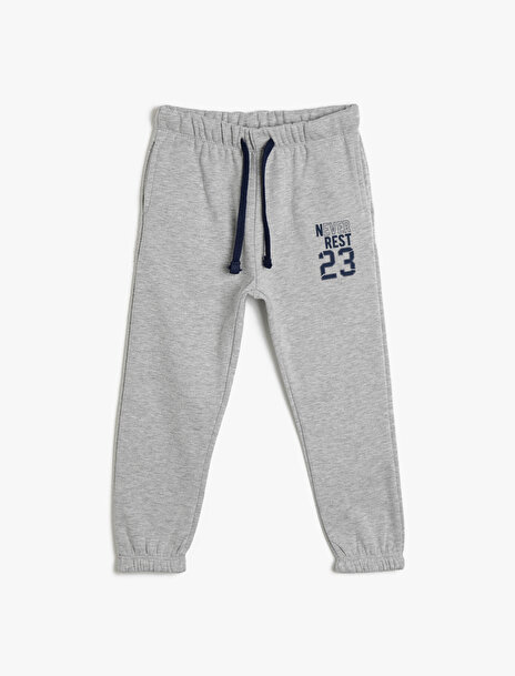 Koton Erkek Çocuk Baskılı Sweatshirt Kumaşından Cep Detaylı Paçası Lastikli Eşofman Altı