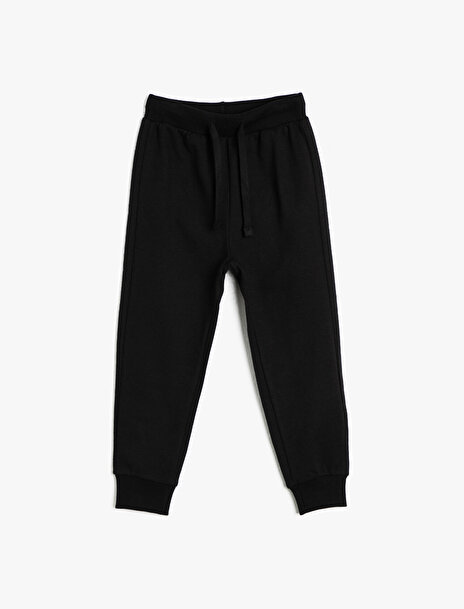 Koton Erkek Çocuk İçi Yumuşak Tüylü Sweatshirt Kumaşından Paçası Ribanalı Jogger Eşofman Altı Koton Erkek Çocuk İçi Yumuşak Tüylü Sweatshirt Kumaşından Paçası Ribanalı Jogger Eşofman Altı