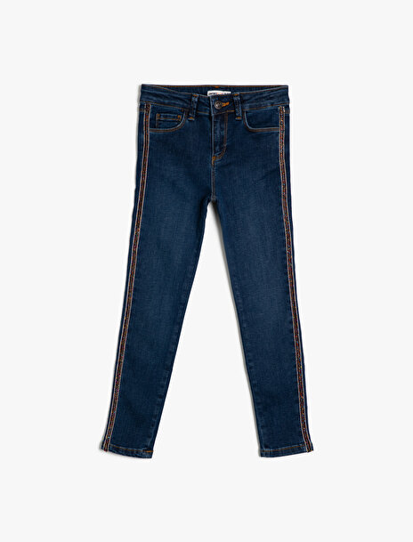 Koton Kız Çocuk Yanı Simli Şeritli Beli Ayar Lastikli Dar Kalıp Normal Bel Jean Pantolon Koton Kız Çocuk Yanı Simli Şeritli Beli Ayar Lastikli Dar Kalıp Normal Bel Jean Pantolon