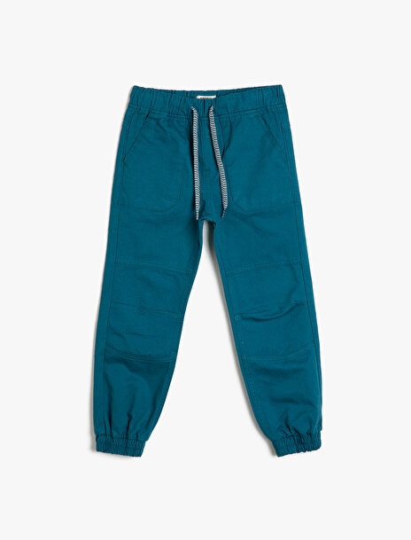 Koton Erkek Çocuk Beli ve Paçası Lastikli Pamuklu Gabardin Kumaştan Jogger Pantalon Koton Erkek Çocuk Beli ve Paçası Lastikli Pamuklu Gabardin Kumaştan Jogger Pantalon