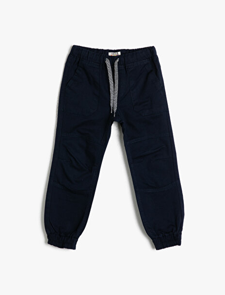 Koton Erkek Çocuk Beli ve Paçası Lastikli Pamuklu Gabardin Kumaştan Jogger Pantalon Koton Erkek Çocuk Beli ve Paçası Lastikli Pamuklu Gabardin Kumaştan Jogger Pantalon