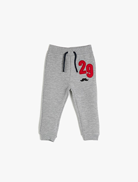 Koton Erkek Çocuk Aplikeli Belden Bağlamalı Normal Bel Eşofman Altı Koton Erkek Çocuk Aplikeli Belden Bağlamalı Normal Bel Eşofman Altı