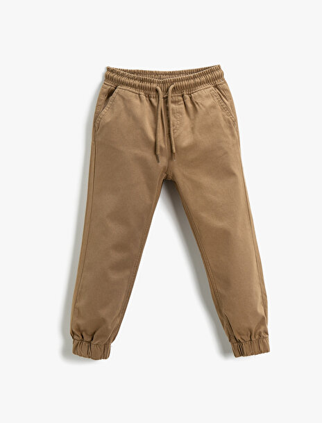 Koton Erkek Çocuk Jogger Pantolon Chino Beli Bağlamalı Cepli Koton Erkek Çocuk Jogger Pantolon Chino Beli Bağlamalı Cepli