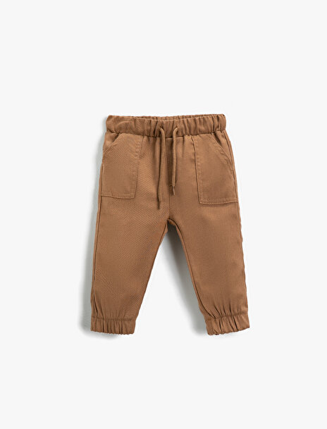 Koton Erkek Çocuk Jogger Belden Bağlamalı Pantolon Cepli Koton Erkek Çocuk Jogger Belden Bağlamalı Pantolon Cepli