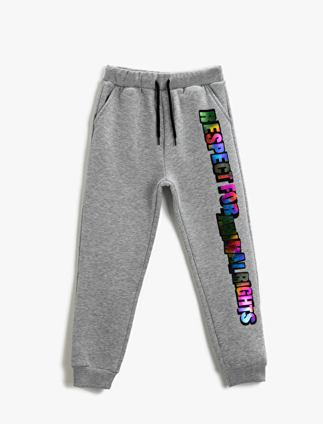 Koton Erkek Çocuk Neon Slogan Baskılı Eşofman Altı Beli Bağlamalı Cepli Jogger Koton Erkek Çocuk Neon Slogan Baskılı Eşofman Altı Beli Bağlamalı Cepli Jogger